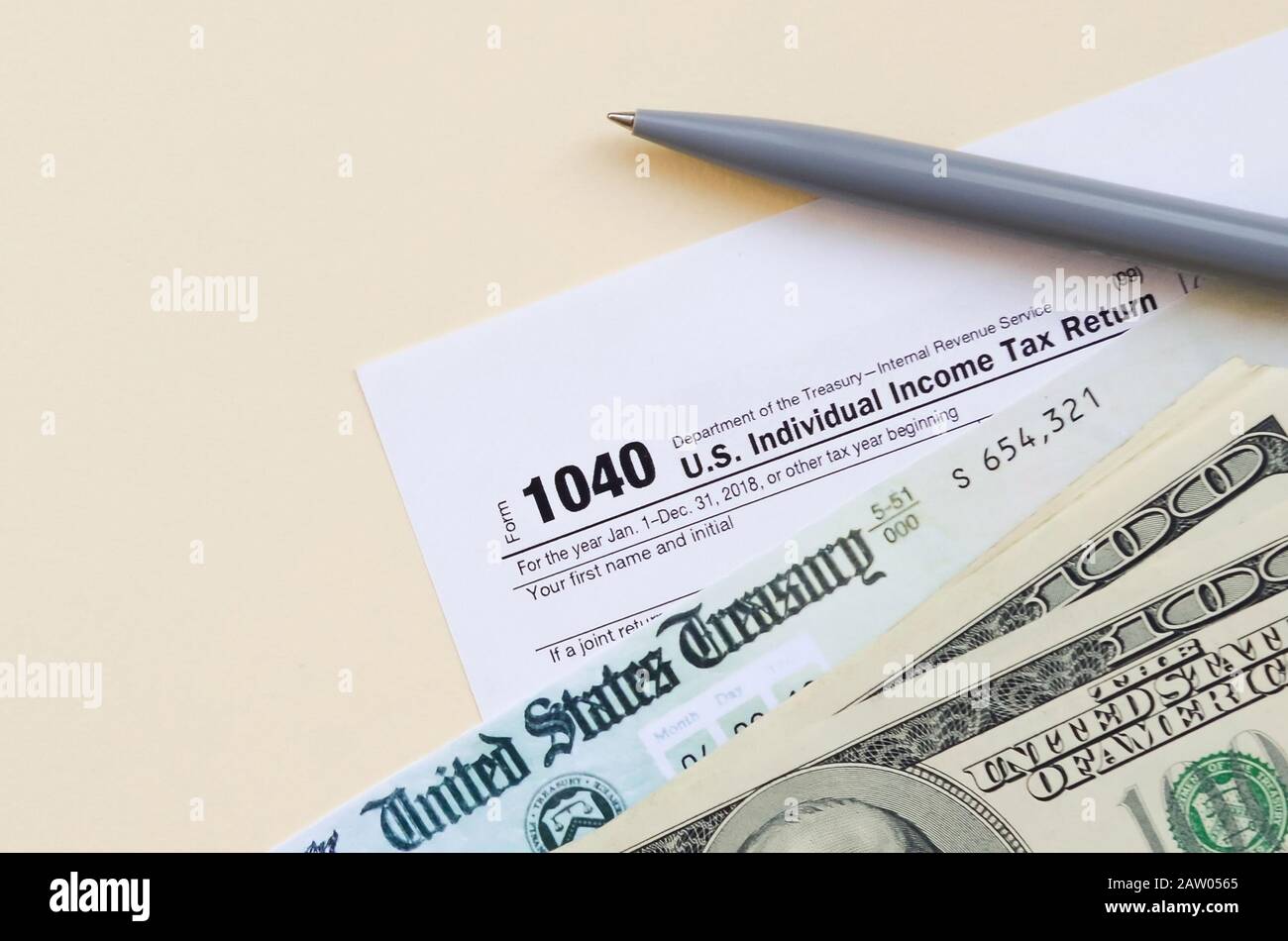 1040 Individual Income tax return form with Refund Check and hundred ...