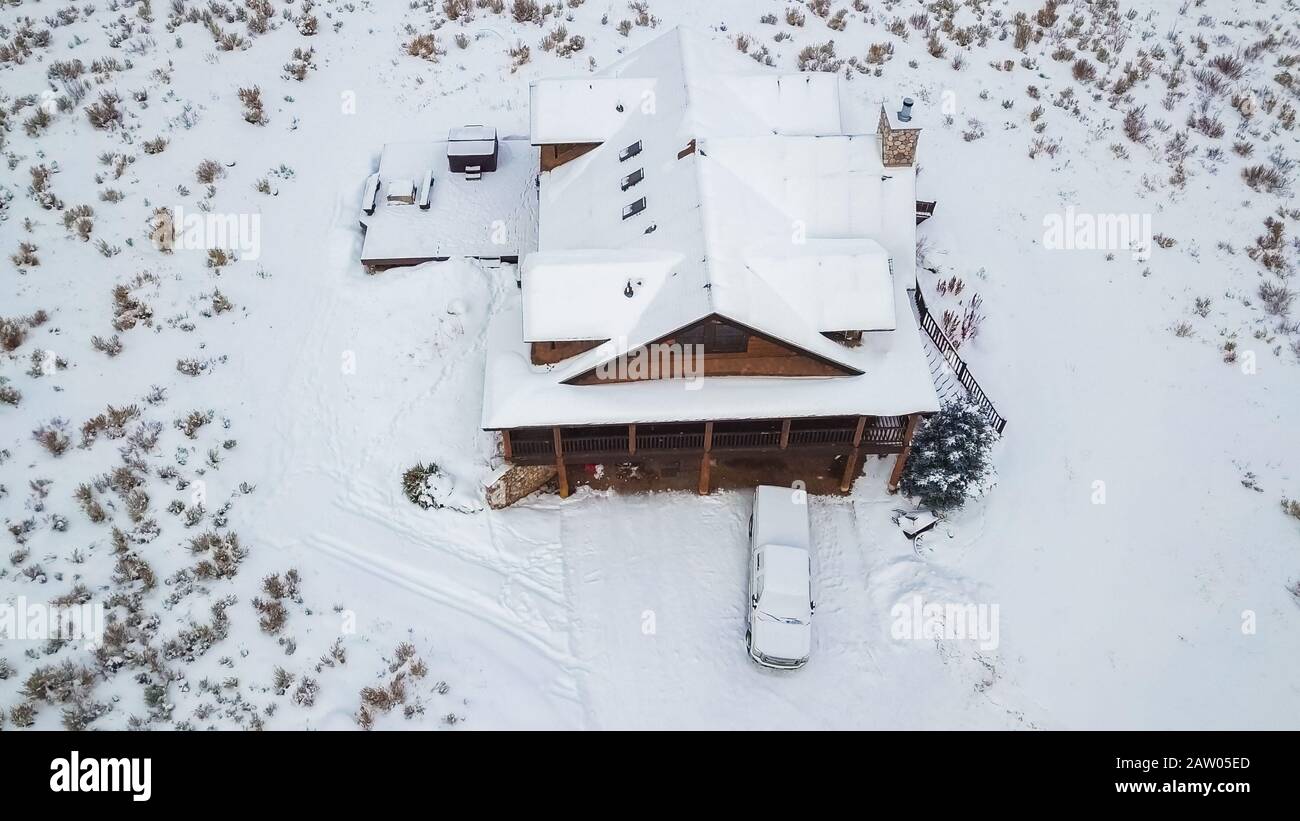 Aerial view of the mountain house covered in snow in the Winter Stock ...