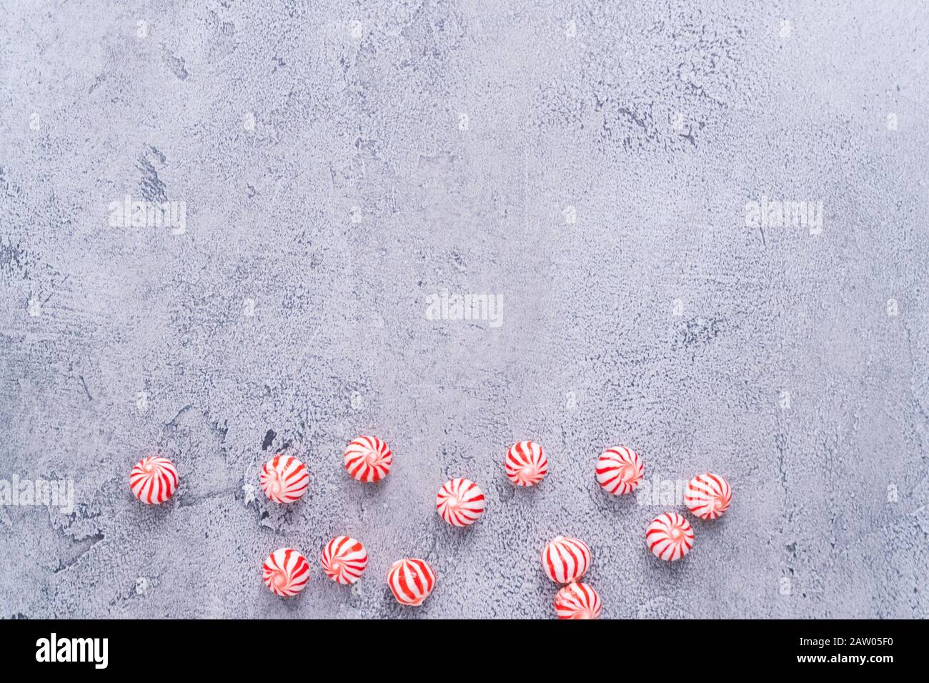 Flat lay. Red and white peppermint round candies Stock Photo - Alamy