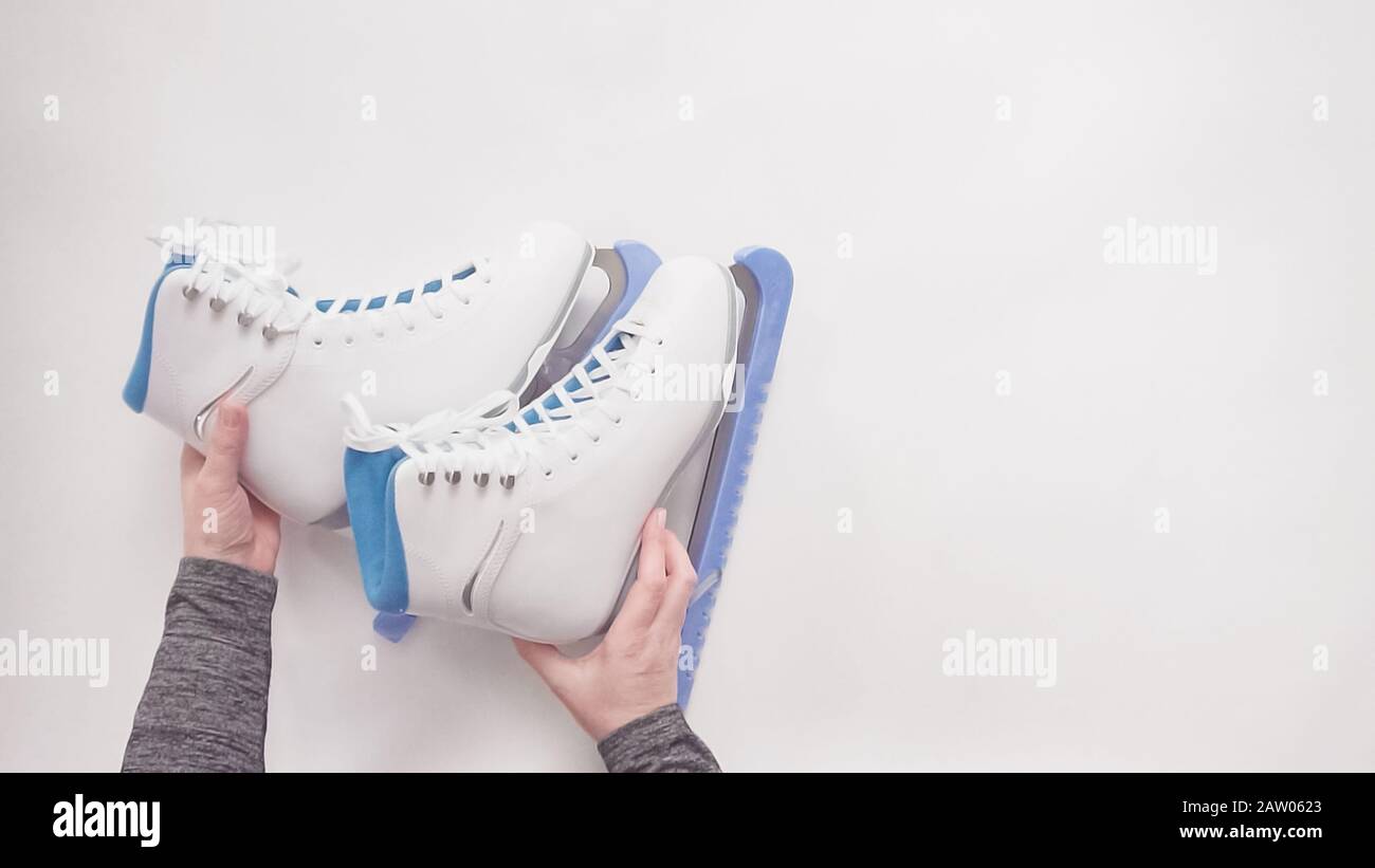 Flat lay. New figure skates on a white background Stock Photo - Alamy