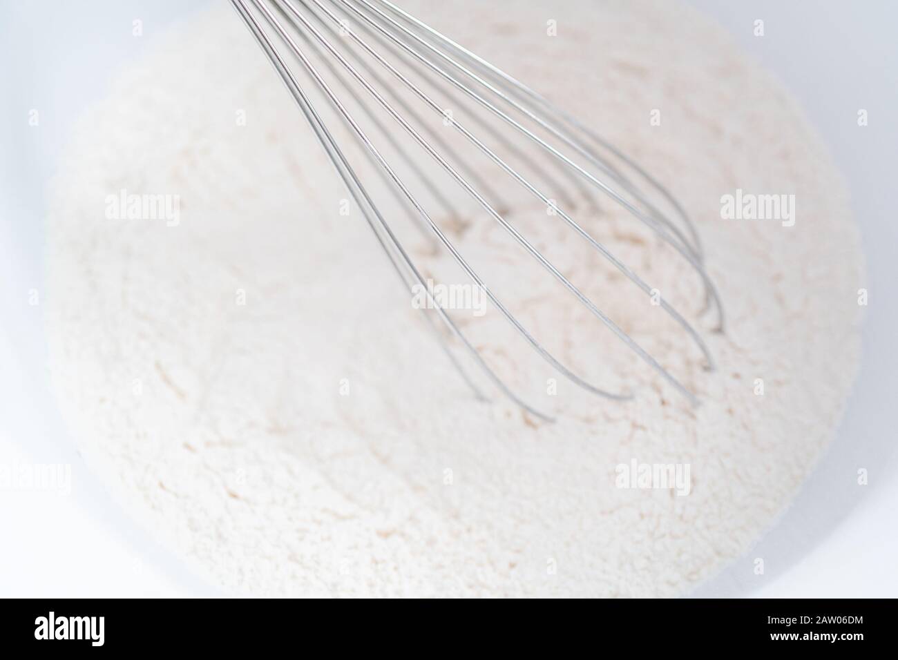 Mixing flour with other dry ingredients to bake a cake Stock Photo - Alamy
