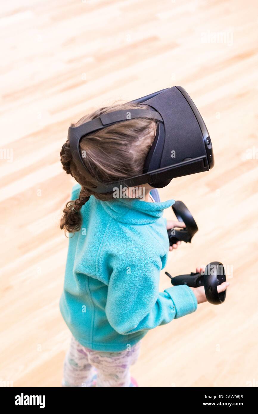 Little girl playing VR kids game in the living room Stock Photo - Alamy