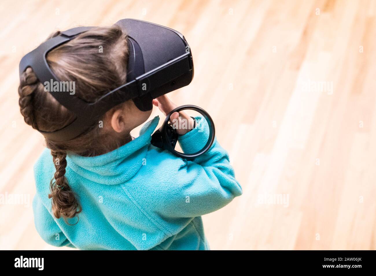 Little girl playing VR kids game in the living room Stock Photo - Alamy