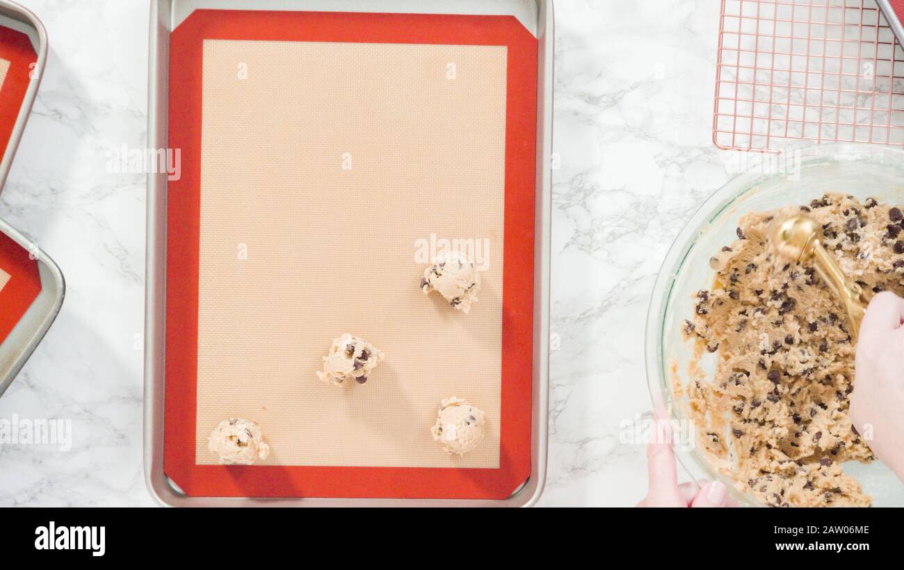 Step by step. Flat lay. Scooping homemade chocolate chip cookies with ...