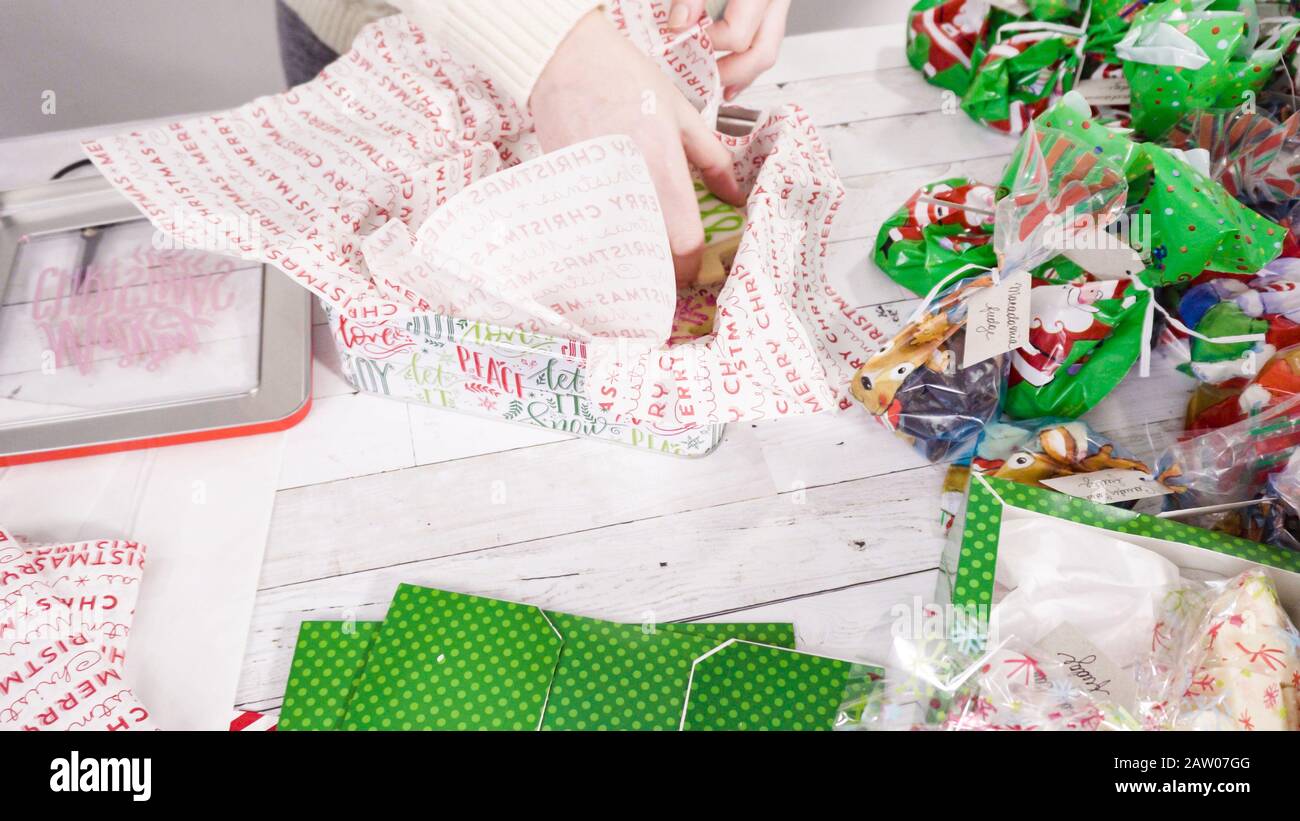 Step by step. Packaging homemade fudge and cookies into a Christmas ...
