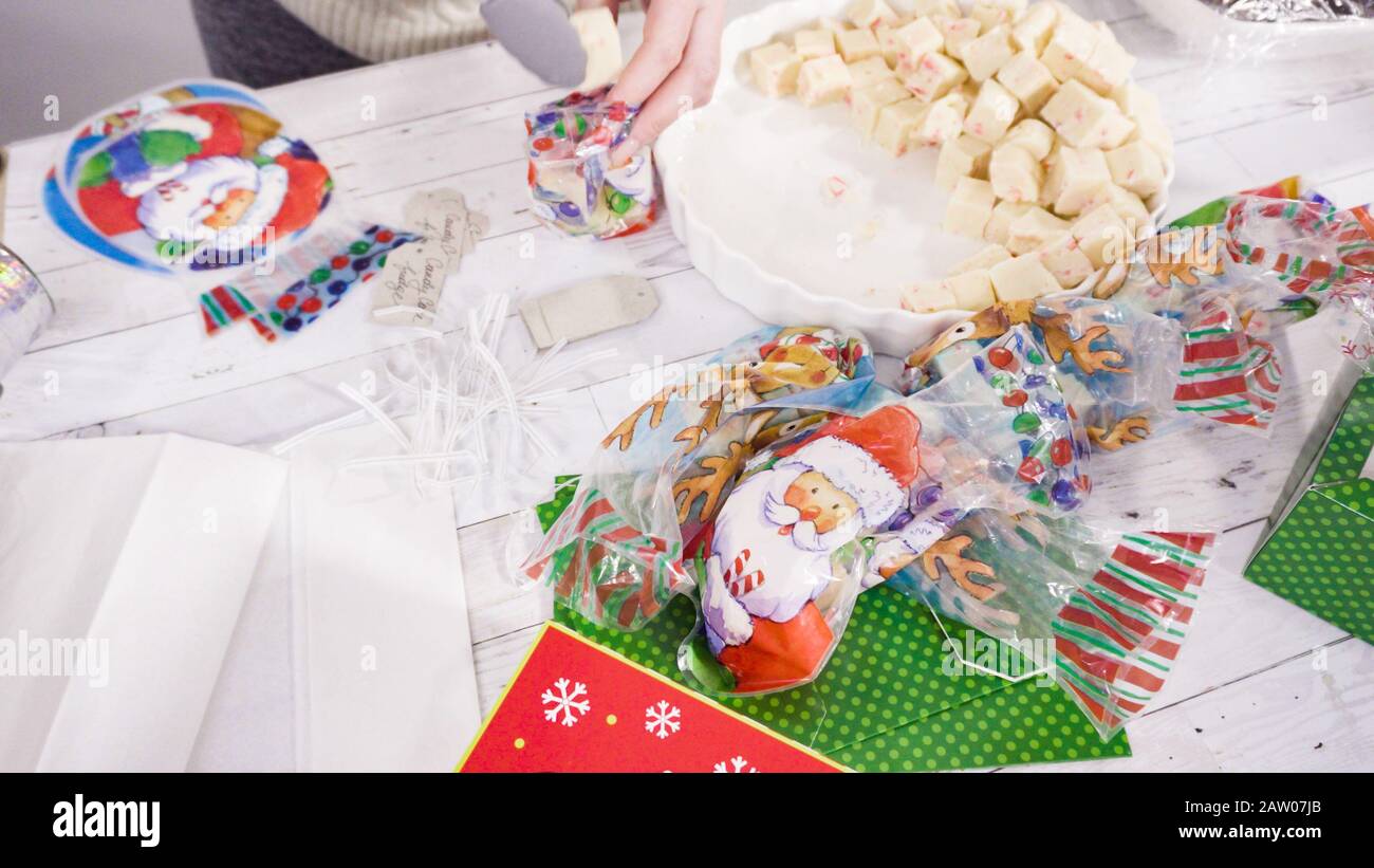 Step by step. Packaging homemade fudge and cookies into a Christmas ...