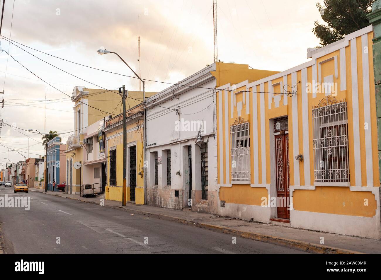 Wooden doors in colorful colonial buildings on a typical street in ...