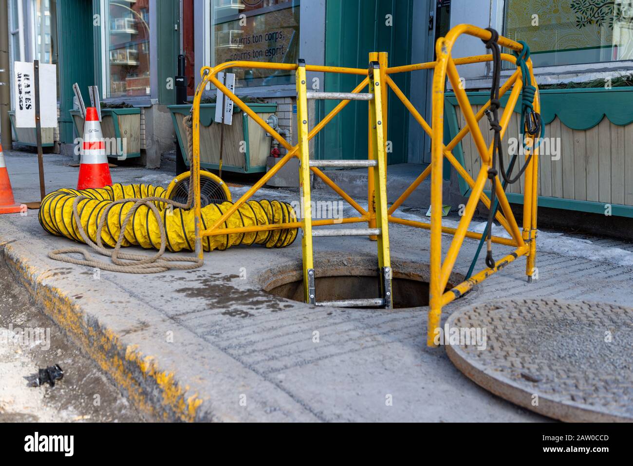 Montreal Quebec Canada February 5 2020: Manhole opened with ladder ...