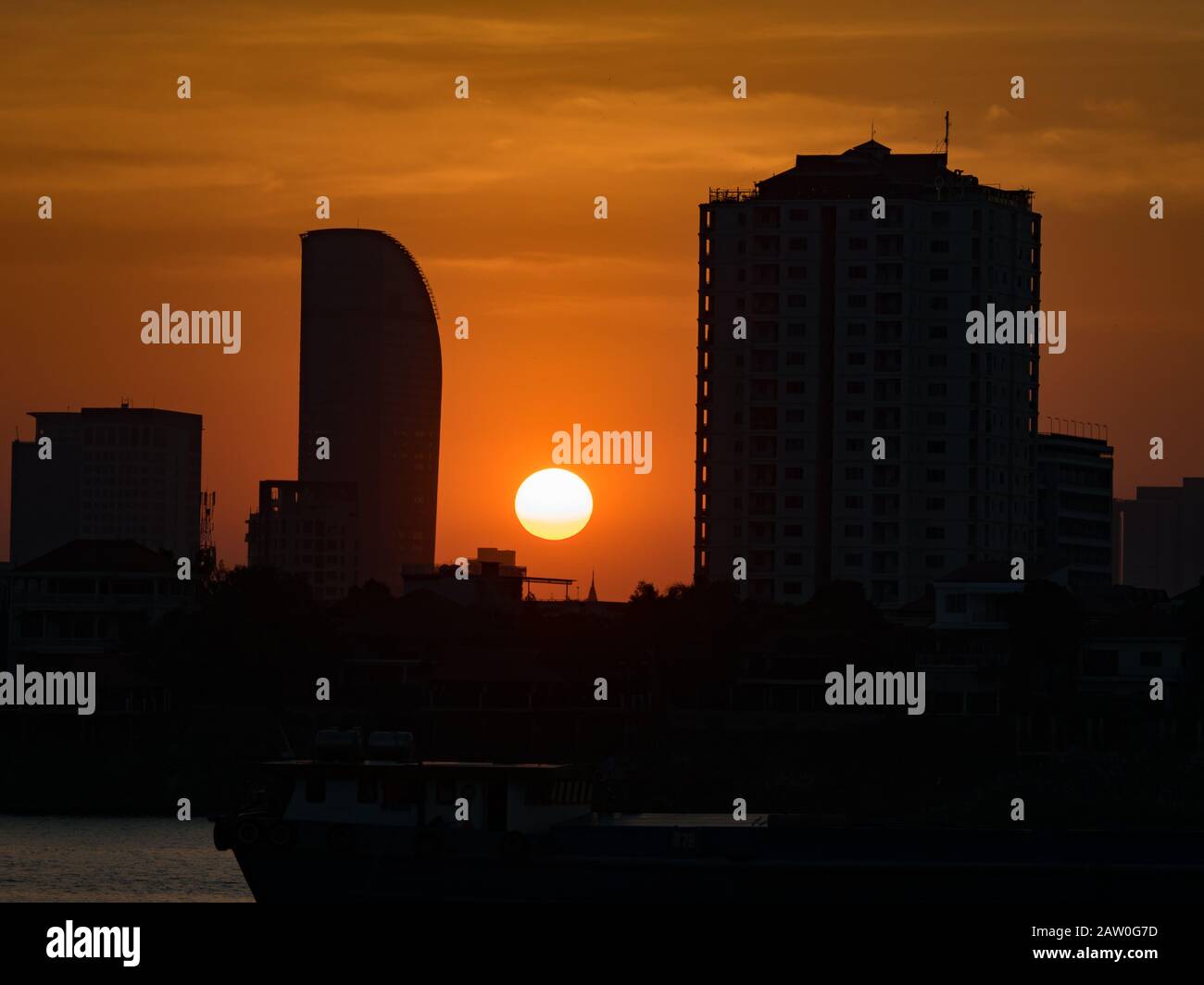 A smoggy sunset over the developing city of Phnom Penh Cambodia Stock ...