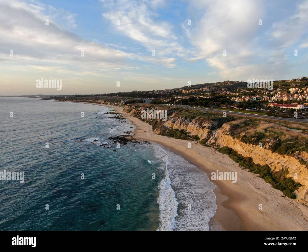 Aerial view of Newport Beach, cliff and beach during sunset twilight in ...