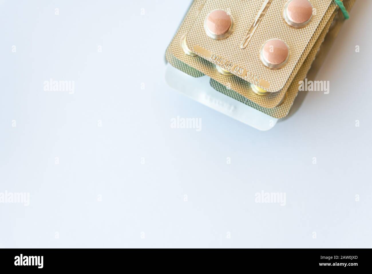 Medicine and pills. Multi-colored medicines on a white background close ...