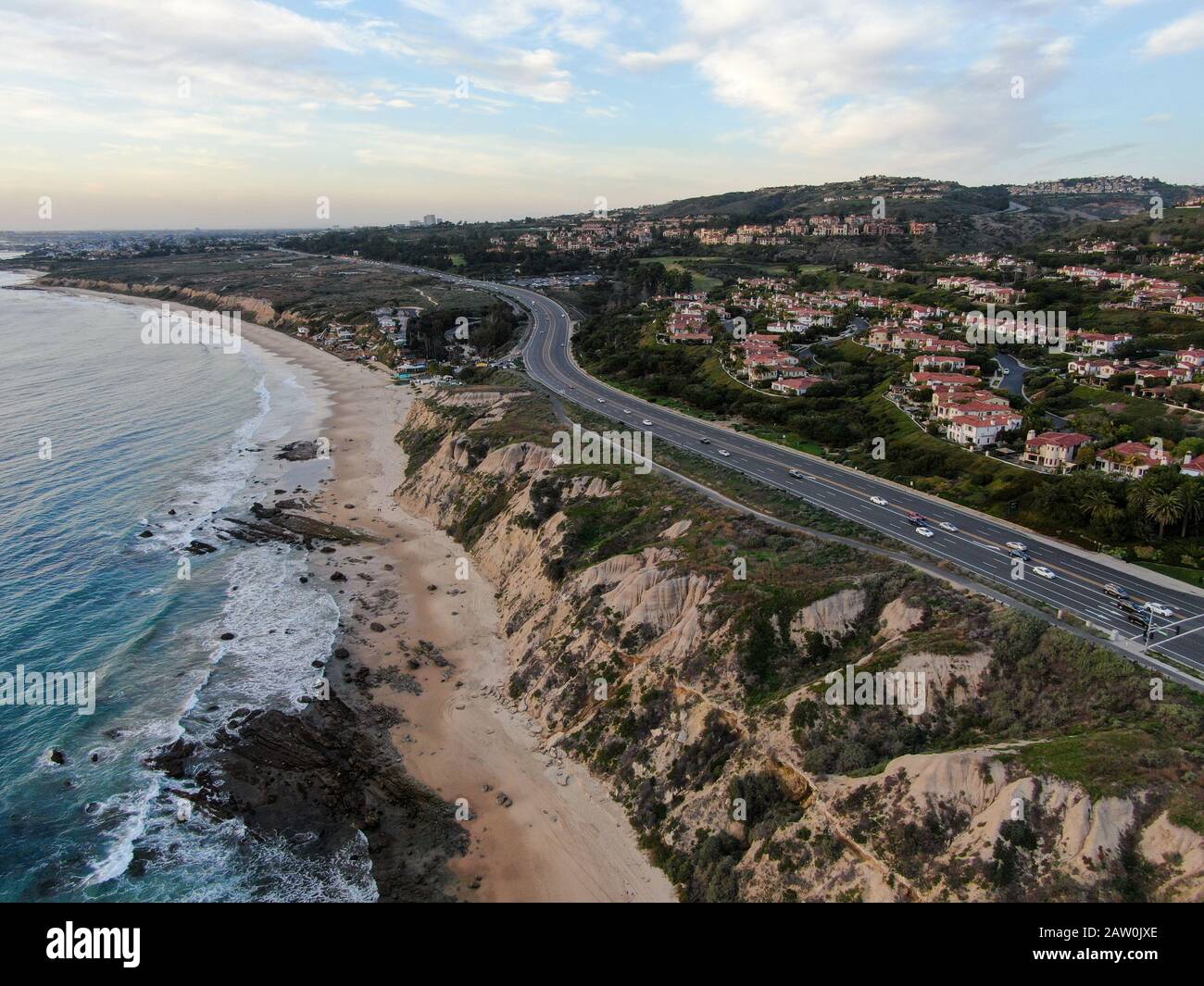 Aerial view of Newport Beach, cliff and beach during sunset twilight in ...