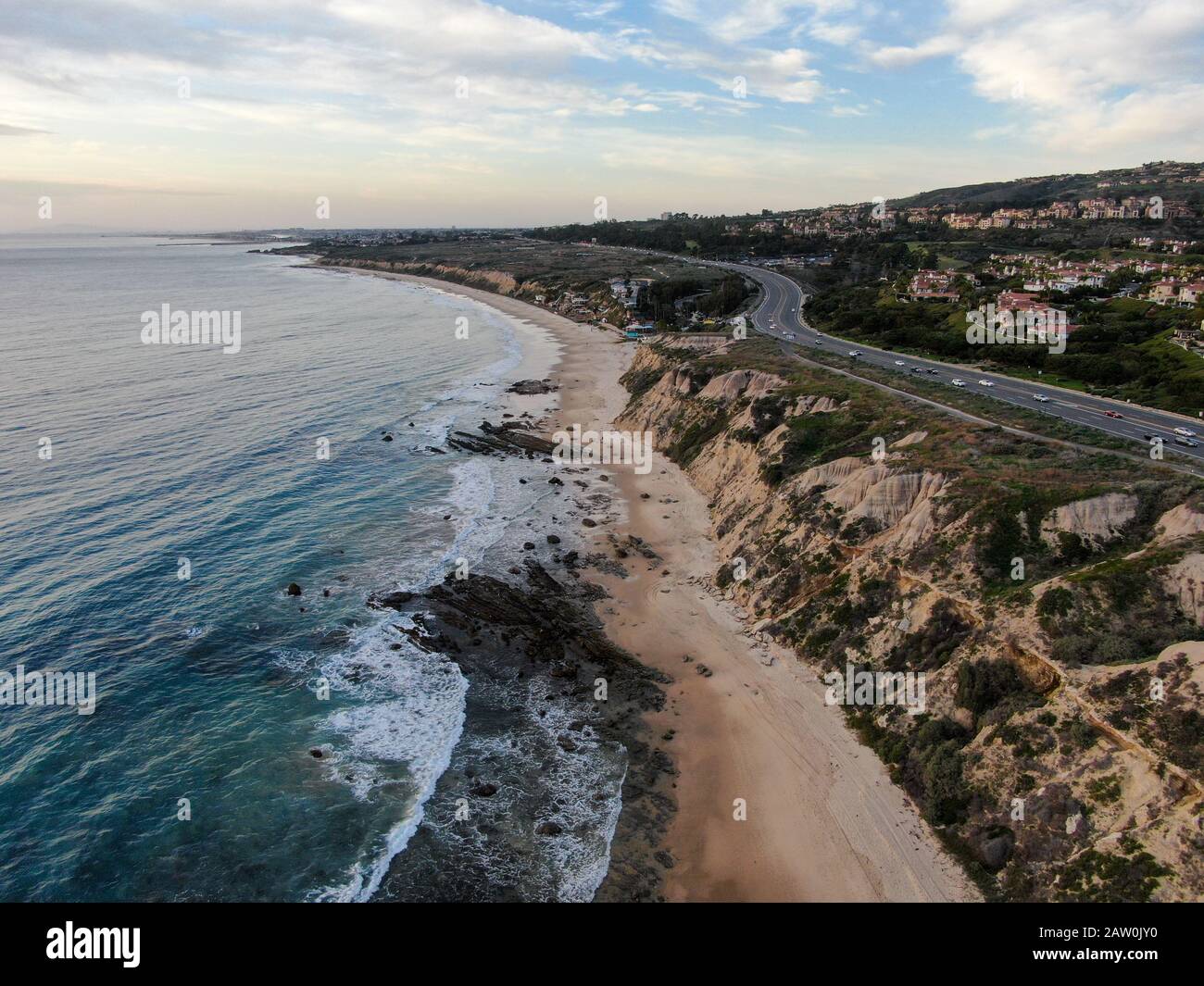 Aerial view of Newport Beach, cliff and beach during sunset twilight in ...