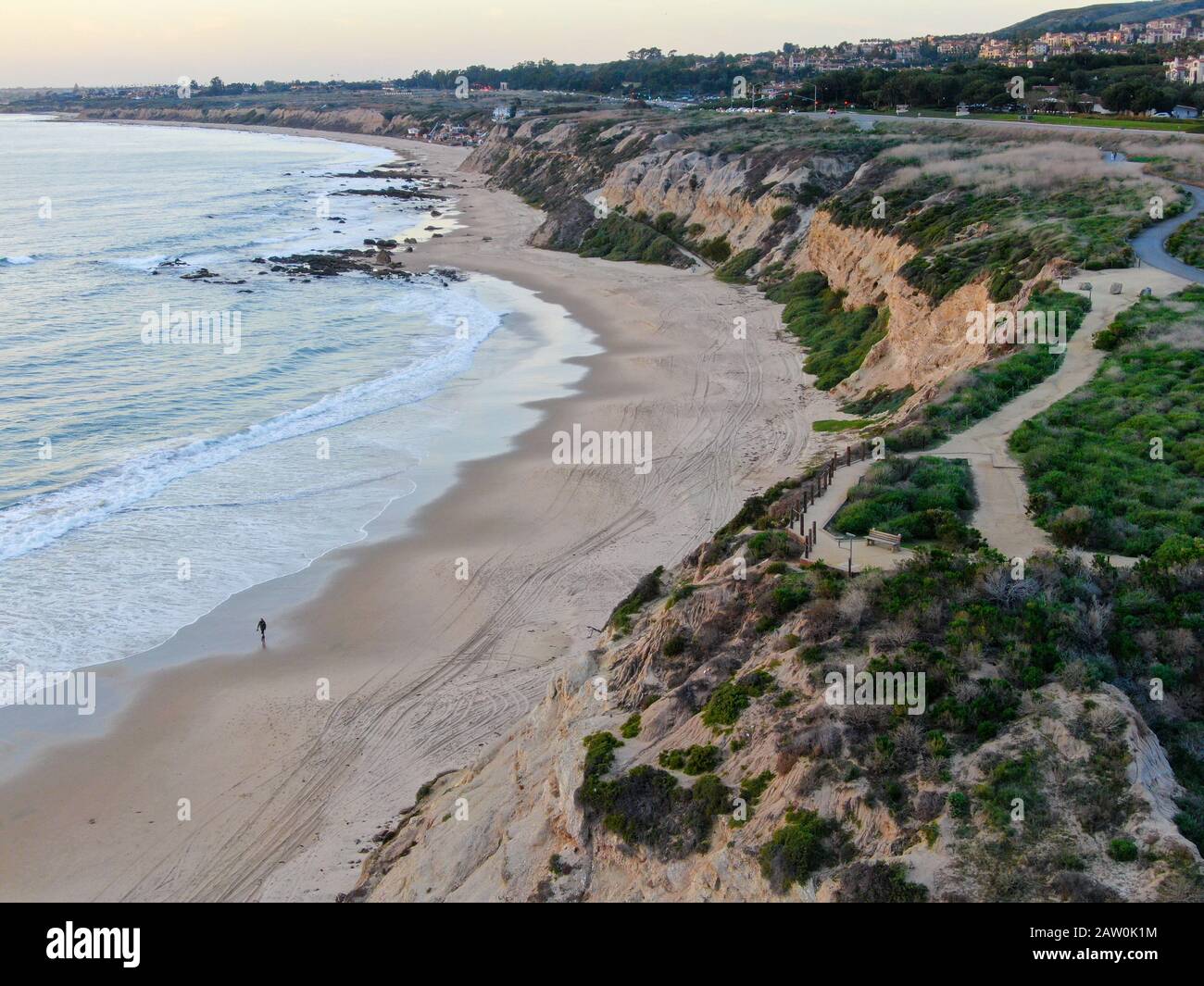 Aerial view of Newport Beach, cliff and beach during sunset twilight in ...