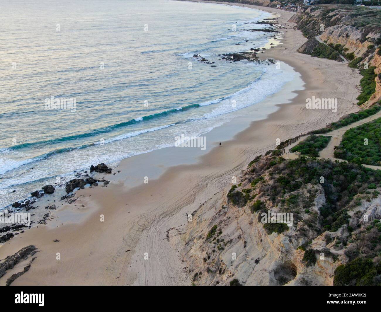 Aerial view of Newport Beach, cliff and beach during sunset twilight in ...