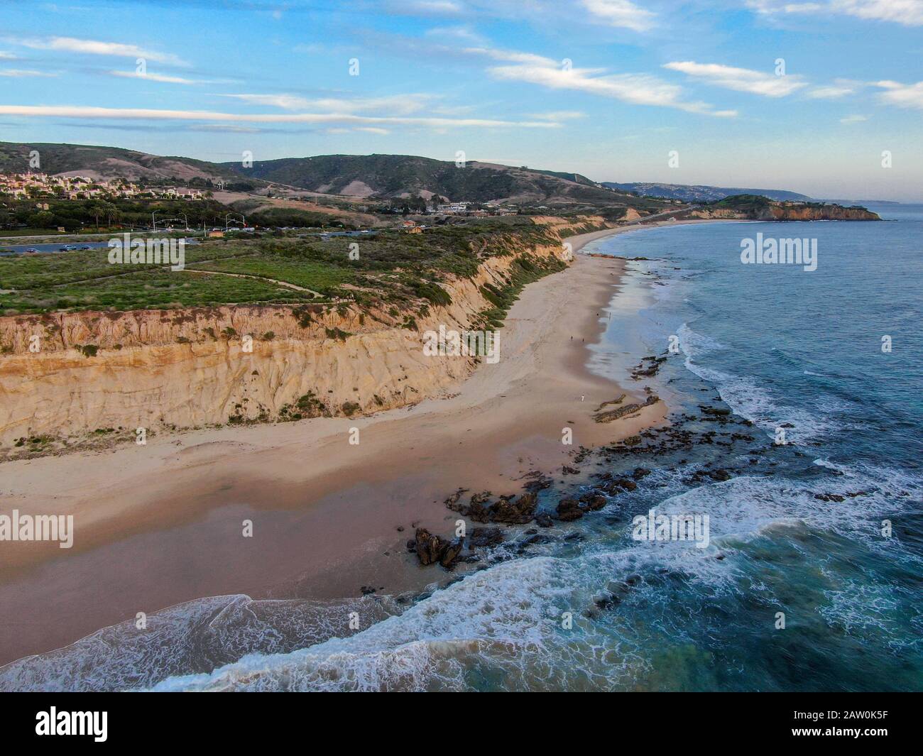 Aerial view of Newport Beach, cliff and beach during sunset twilight in ...