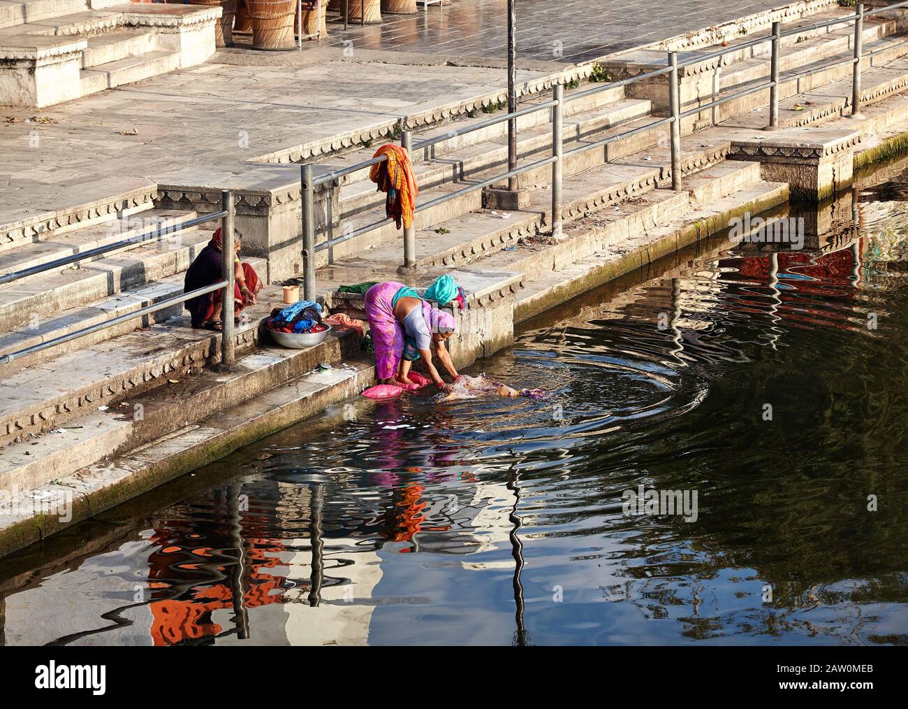 Indian woman washing clothes hi-res stock photography and images - Alamy