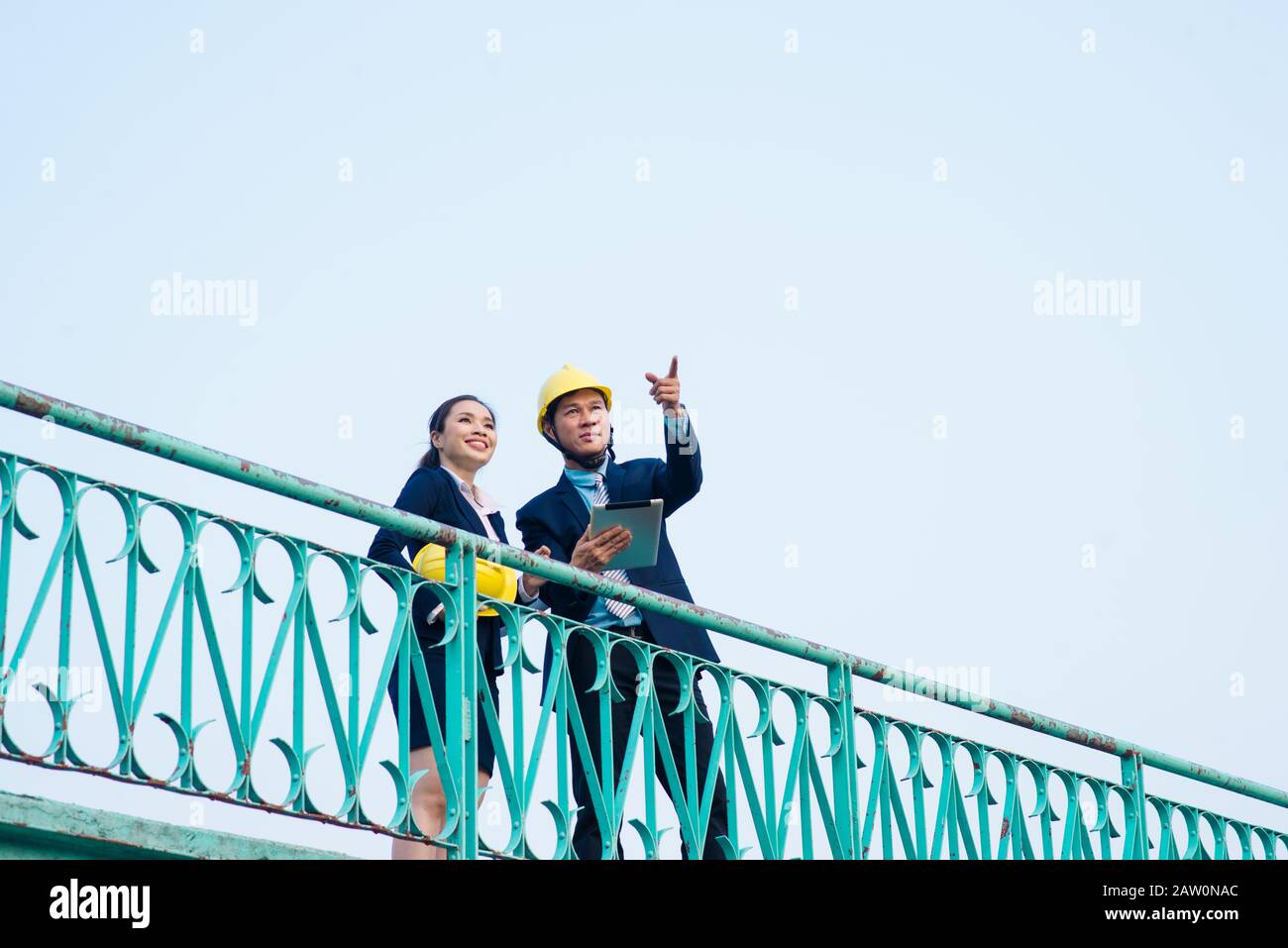 Asian engineer was acting with his secretary on the Business building ...