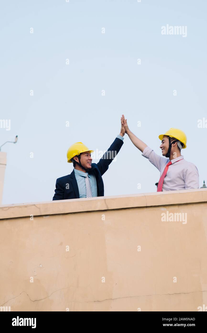 Asian engineer was acting with his secretary on the Business building ...