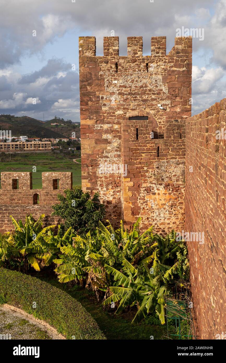 Golden hour view of Silves Castle ruins and watchtower in the winter ...