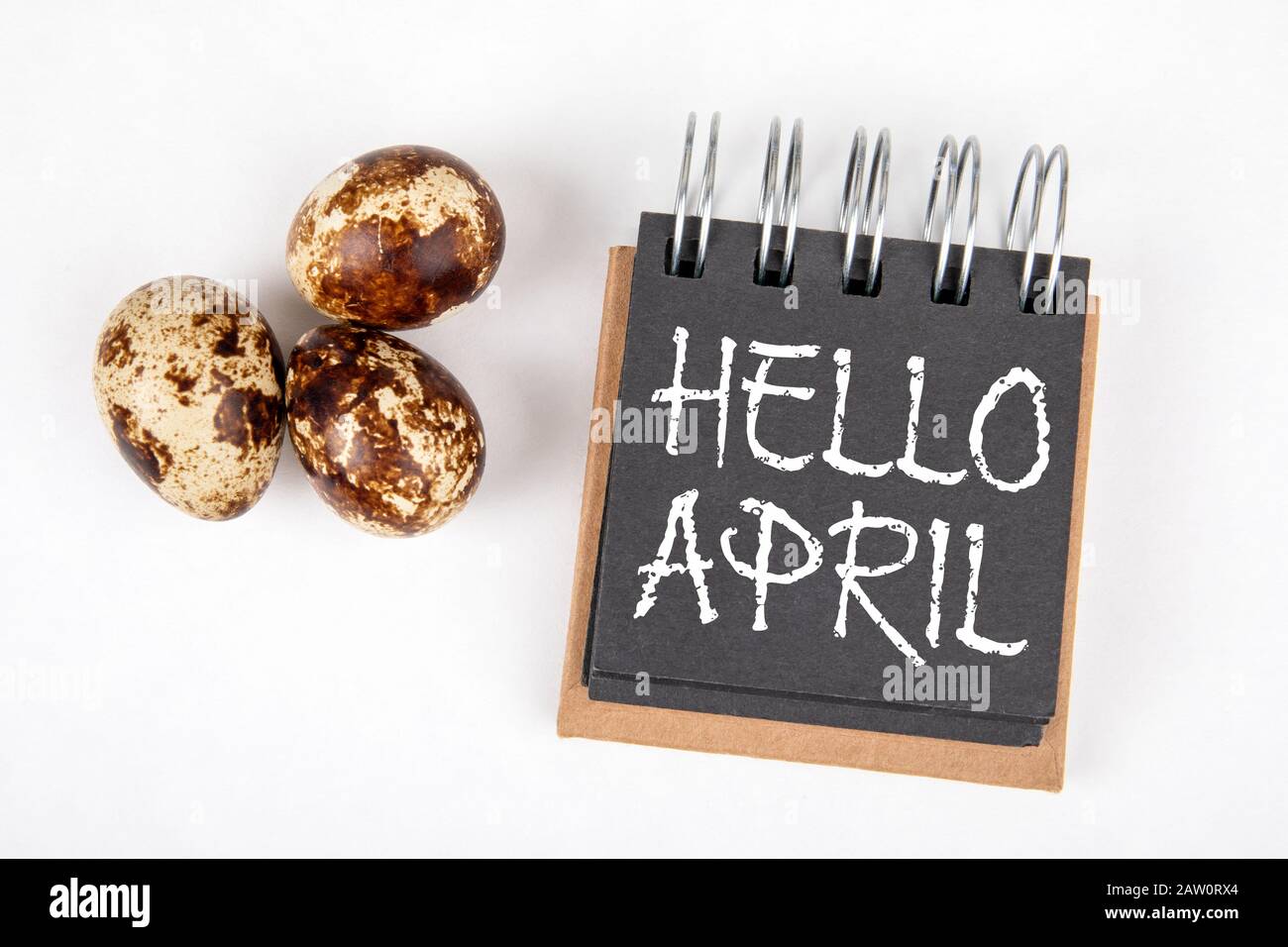 Hello April. Spring, Season, Easter and Holidays Concept. Note book and ...