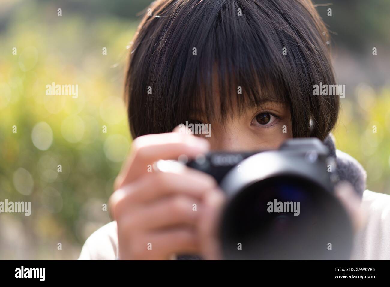 Girl with camera Stock Photo - Alamy