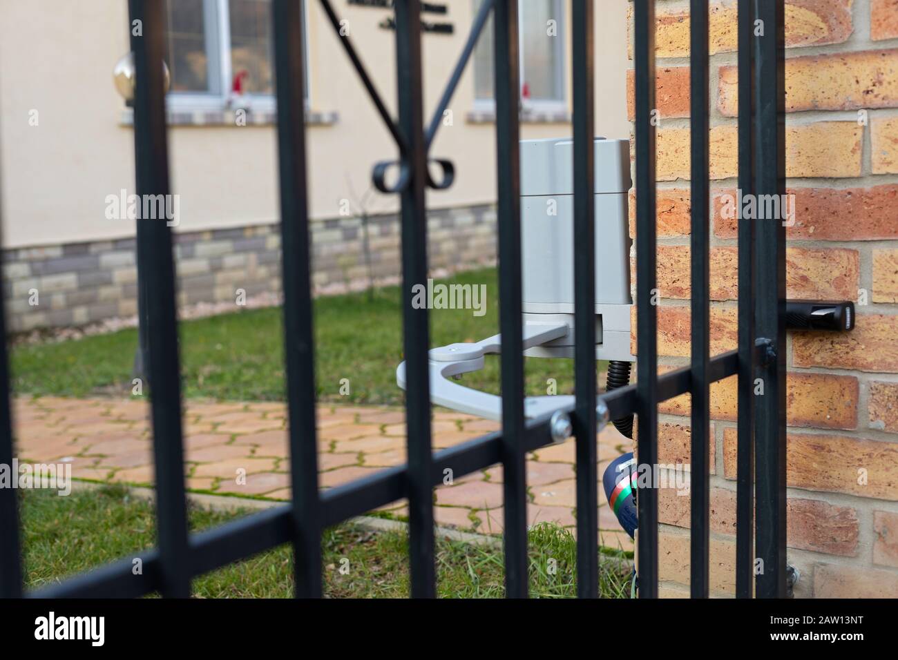 Picture of an automatic door gate with motor Stock Photo - Alamy