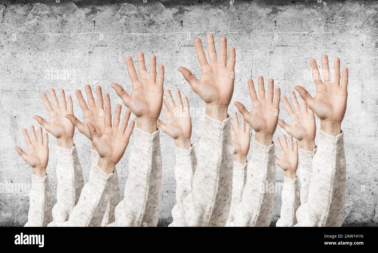 Row of man hands showing voting gesture Stock Photo - Alamy