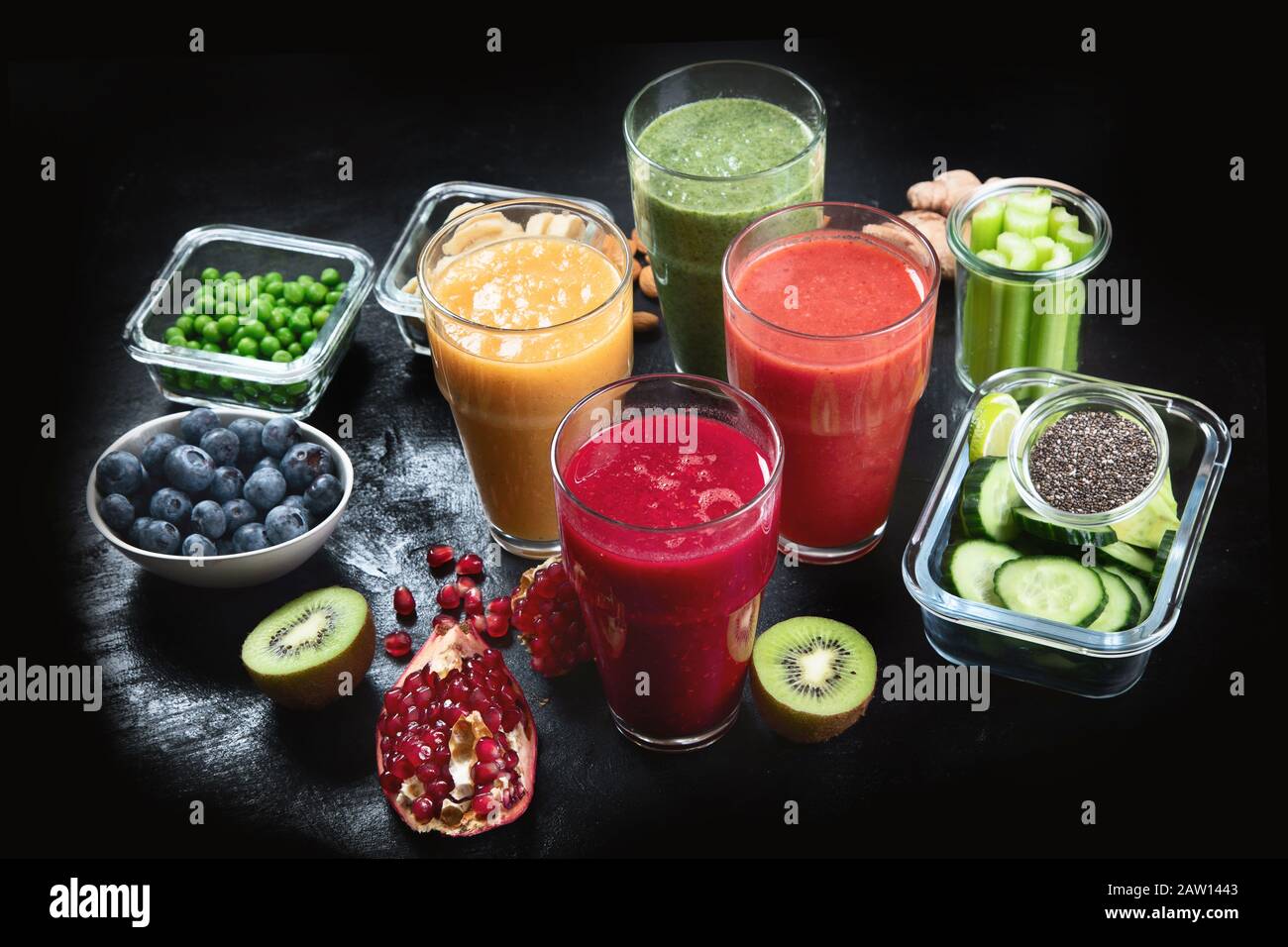 Different types of smoothies on black background. Healthy clean and ...