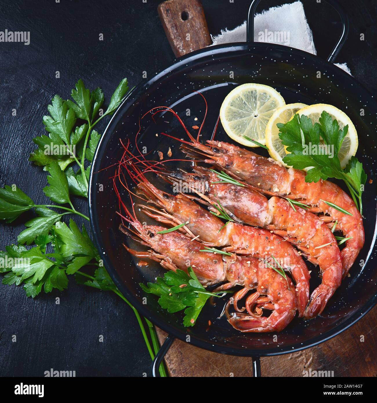 Roasted prawn shrimps on black background. Top view Stock Photo - Alamy