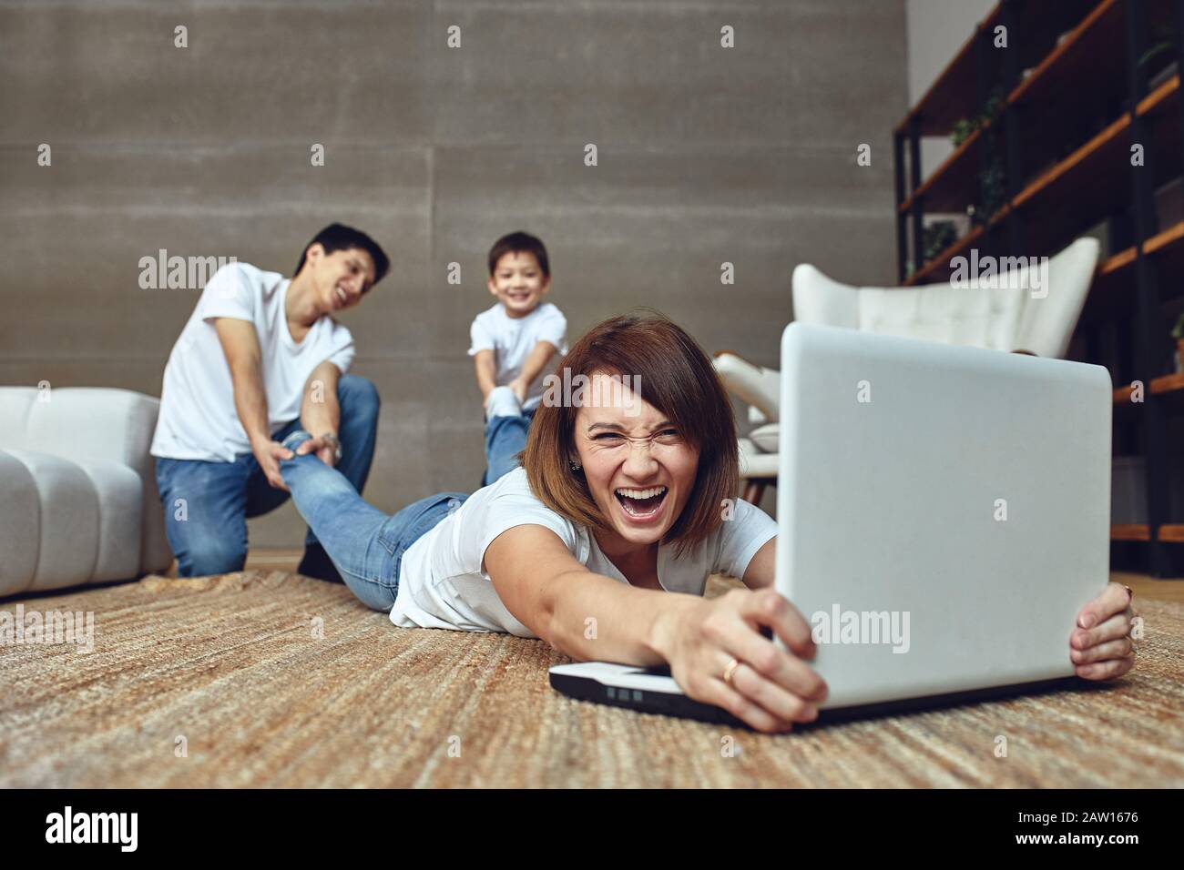 A woman cannot tear herself away from the computer. Dad and son drag ...