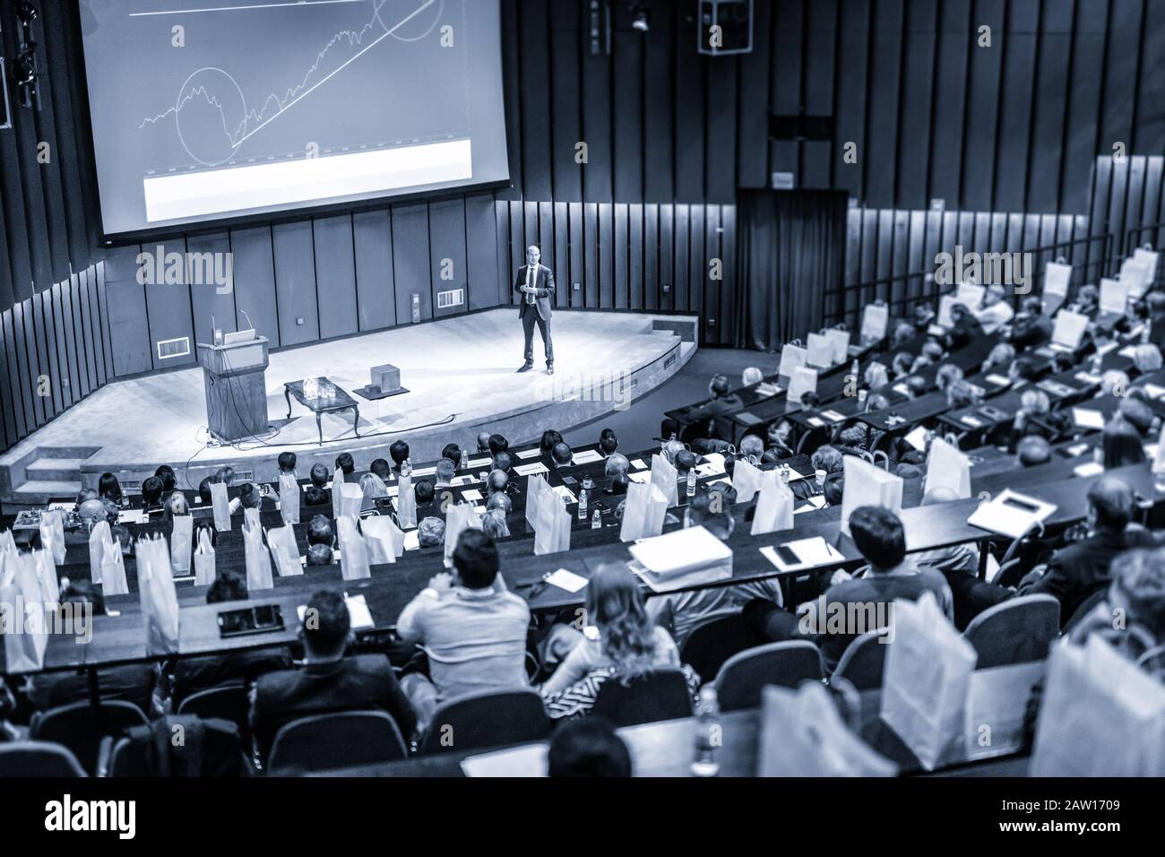 Speaker giving presentation on business conference event Stock Photo ...