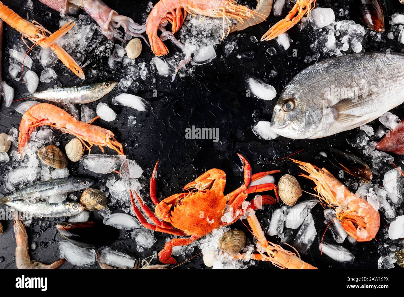 Fish and seafood flat lay background with copy space. Fresh sea bream ...