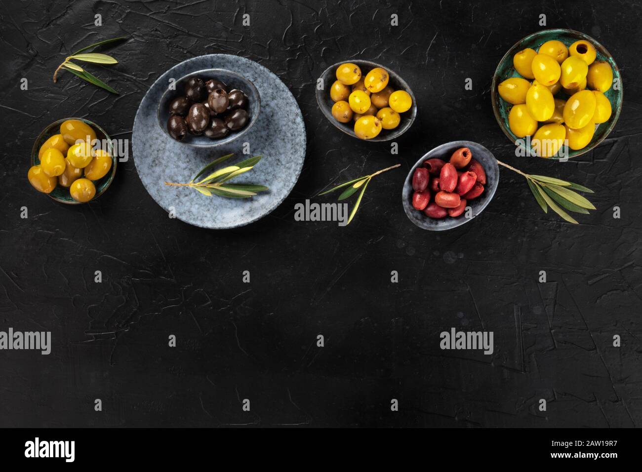 Olives variety, a flat lay with a place for text. Black, green and red ...