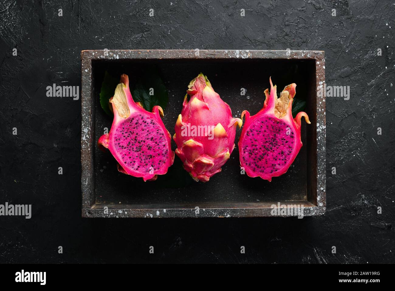 Red Pitahaya on a black background. Fruit Dragon. Tropical Fruits. Top ...