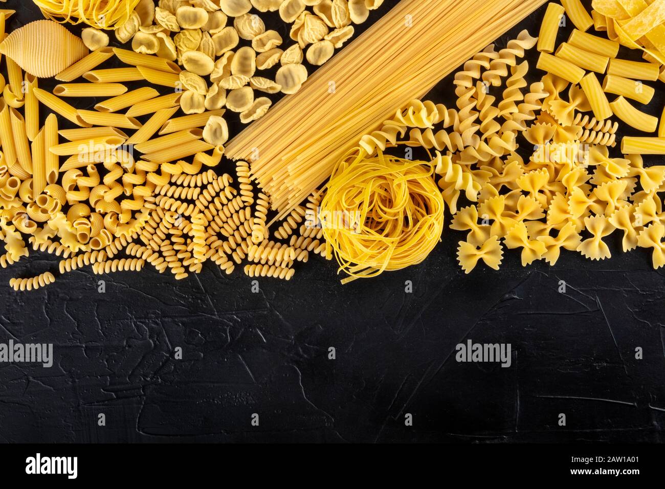 Italian pasta background with copy space, a flat lay of a variety of ...