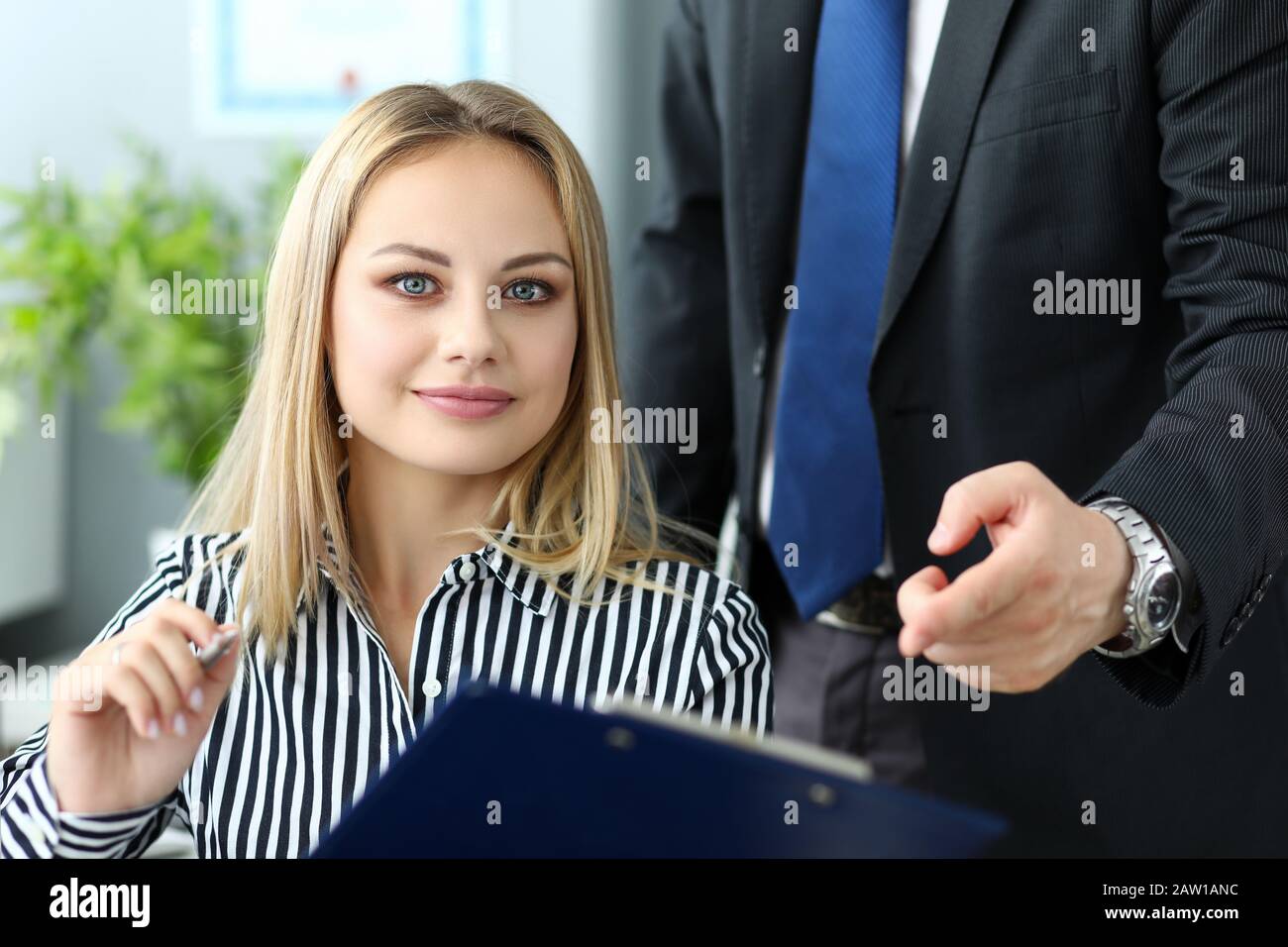 Female manager helps develop company strategy Stock Photo - Alamy