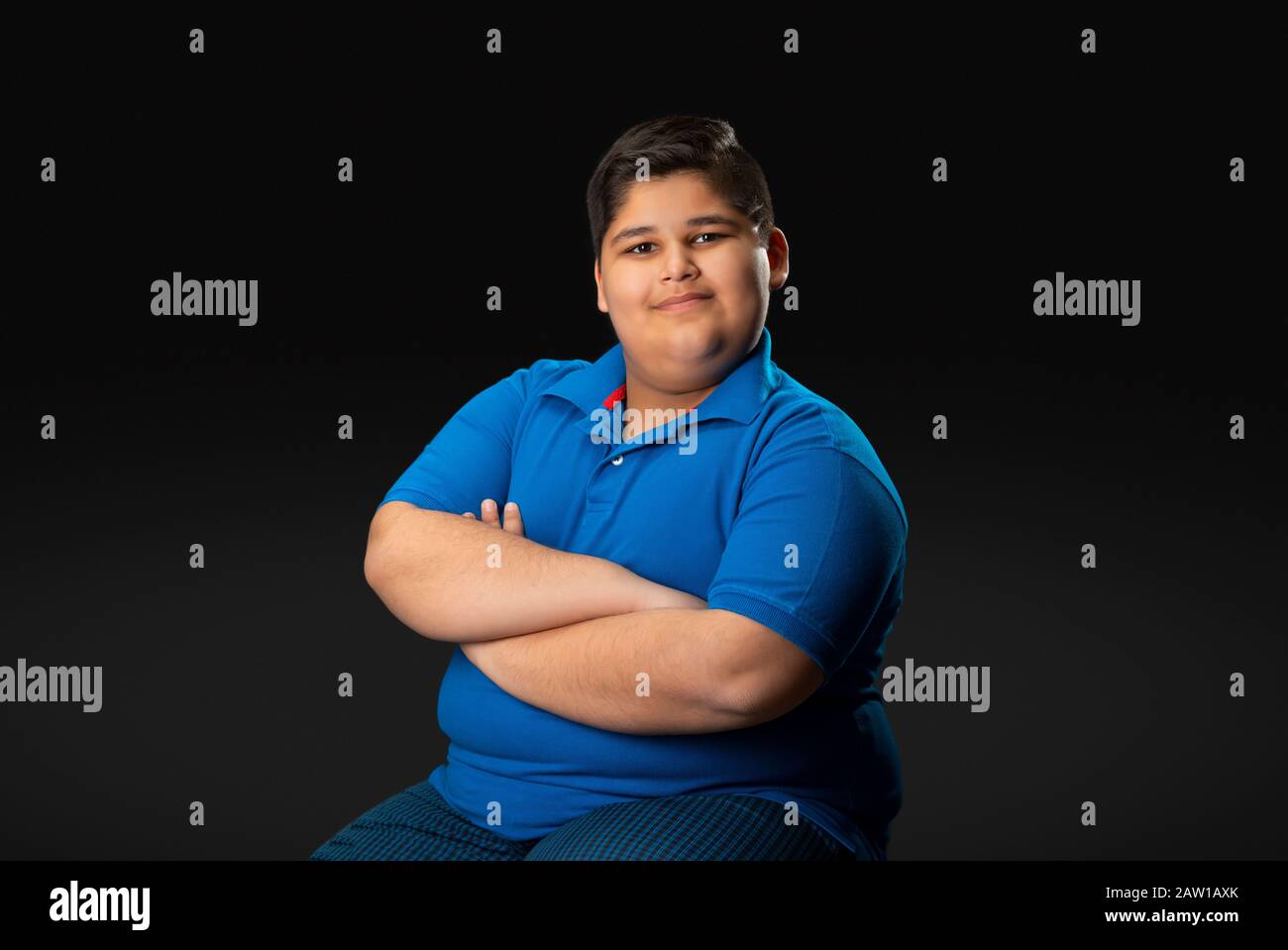 Portrait of a chubby boy smiling. (Obesity Stock Photo - Alamy