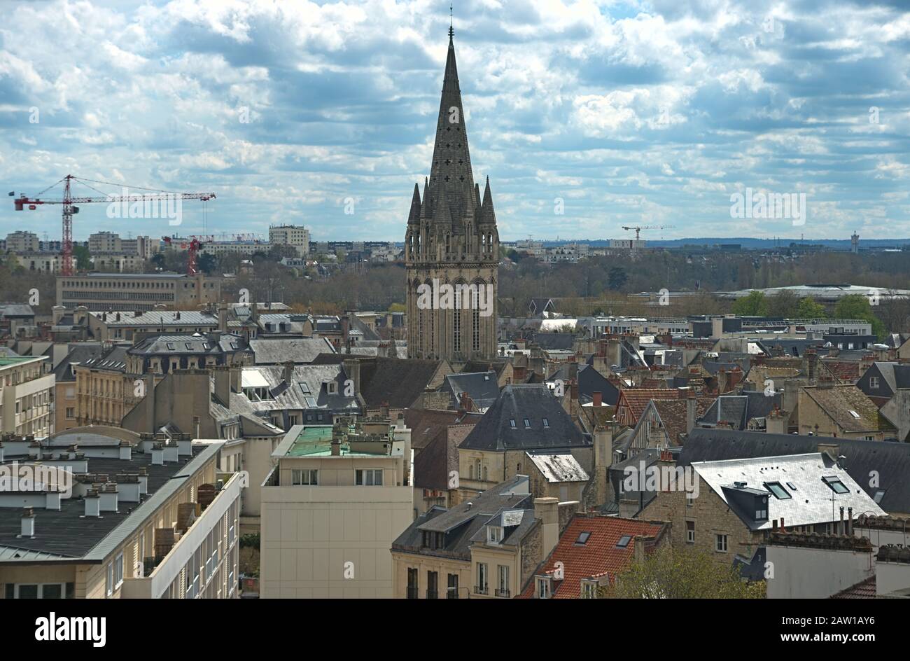 Cityscape of French city Caen with high tower of an catholic cathedral ...