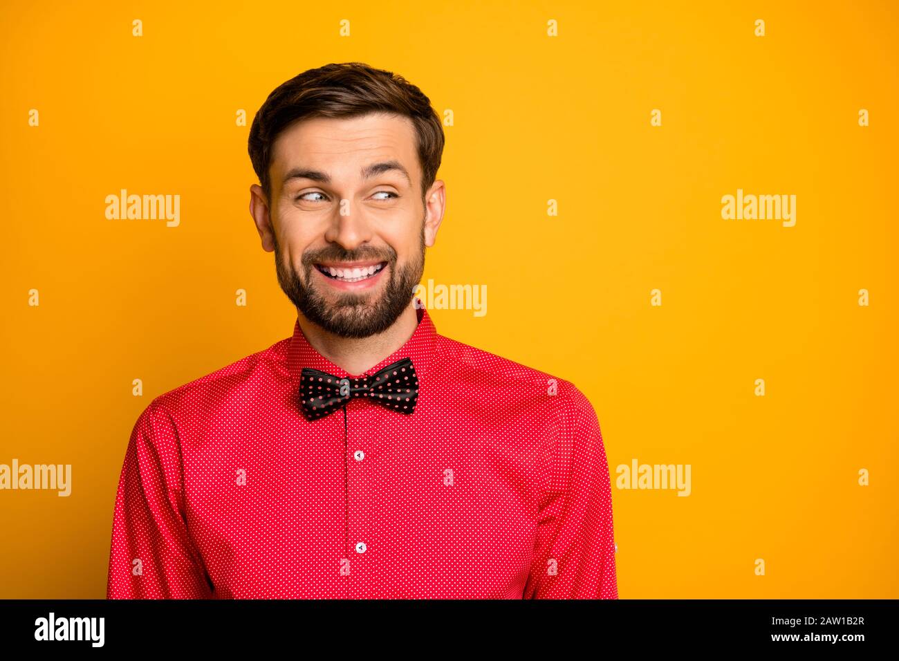 Photo of funny macho guy good mood friendly smiling looking side empty ...