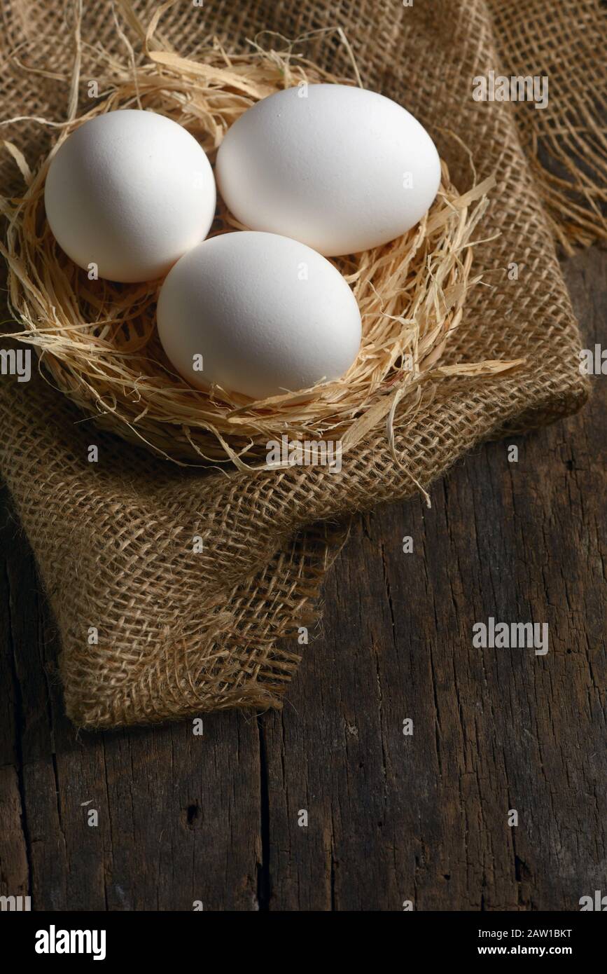 Healthy white farm fresh eggs in nest Stock Photo - Alamy