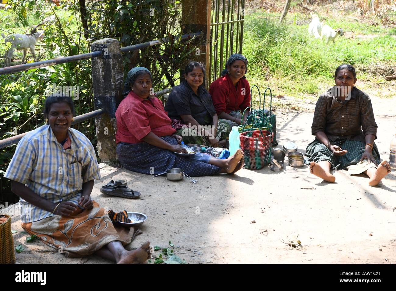 Five happy Indian woman having a lunch break from there job at a spice ...