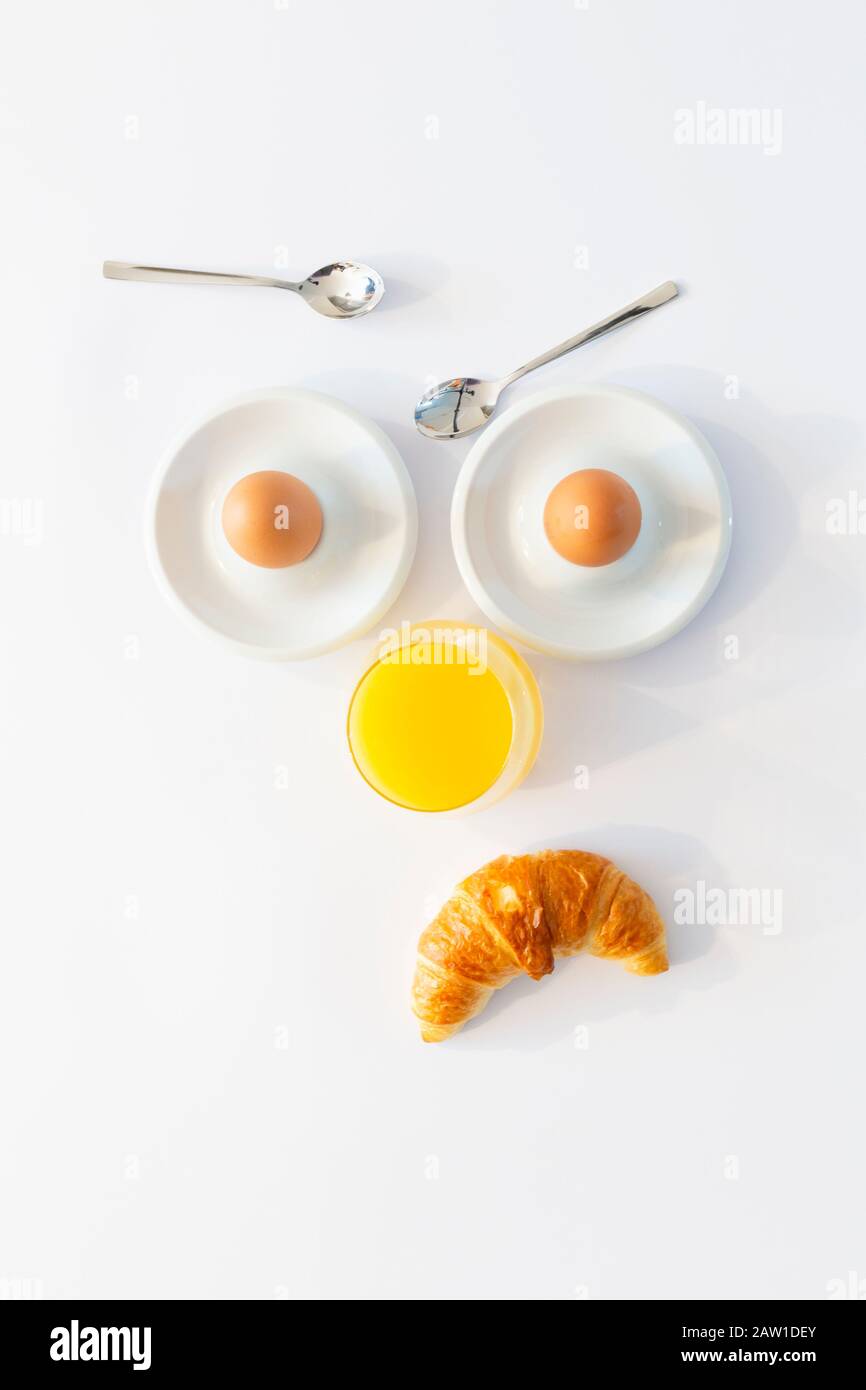 Fun breakfast concept with abstract angry grumpy human face made of ...
