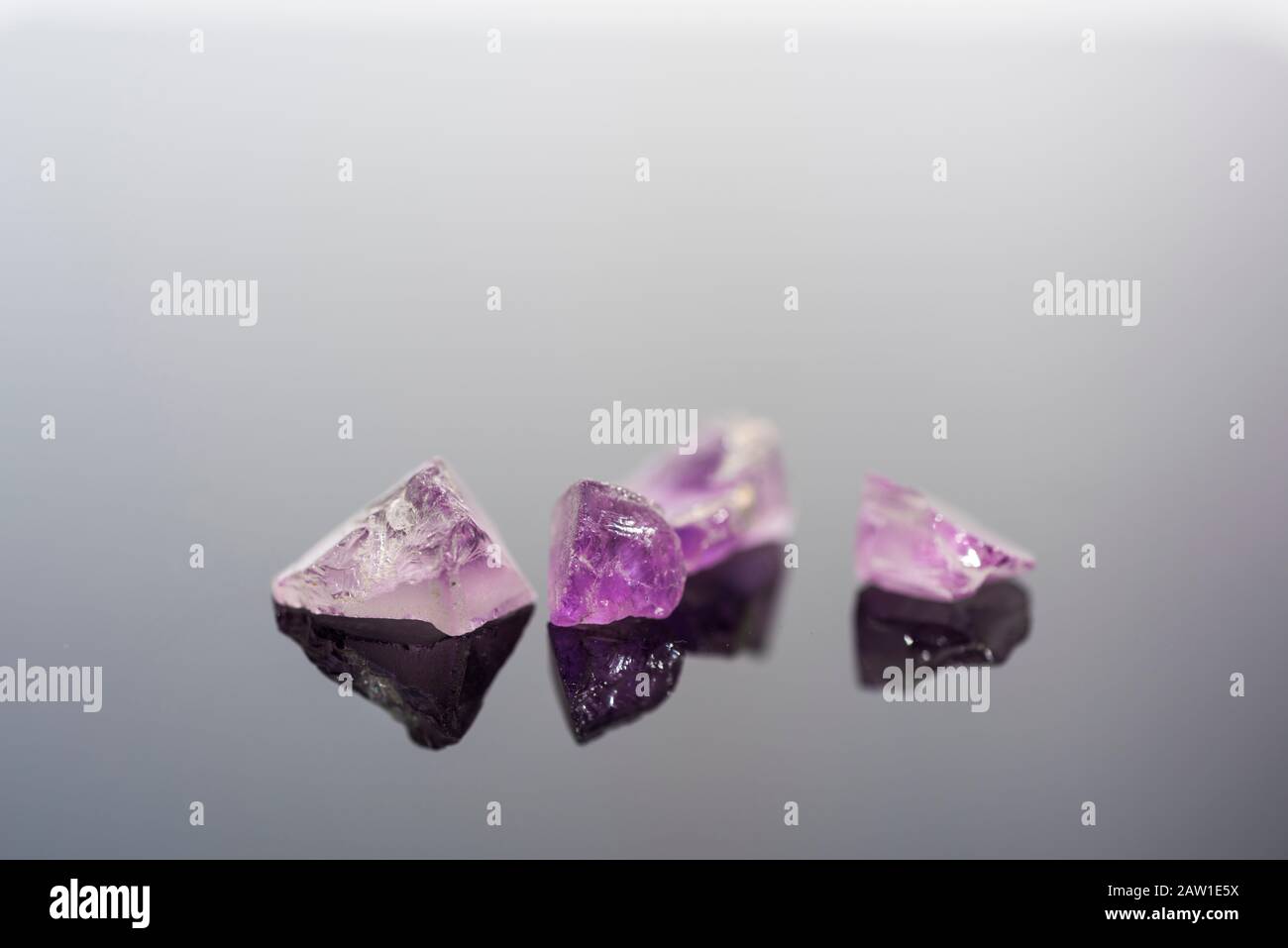 Amethyst small stones. Gems isolated on white background Stock Photo ...
