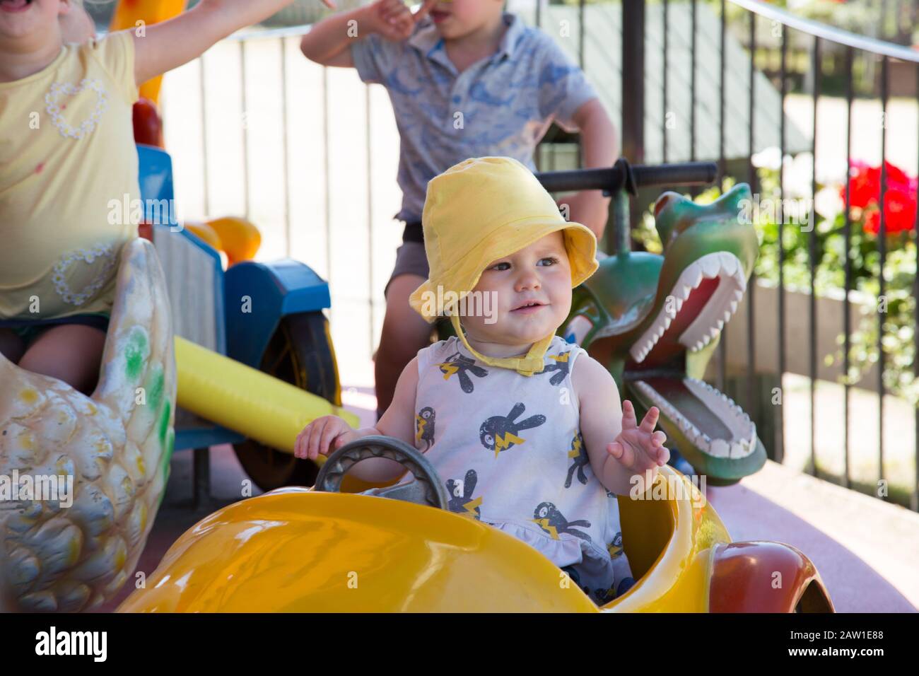 Children on a Merry go Round ride at a funfair, UK Stock Photo - Alamy