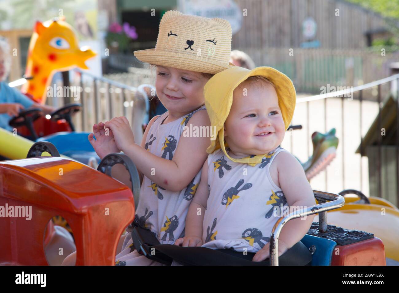 Children on a Merry go Round ride at a funfair, UK Stock Photo - Alamy