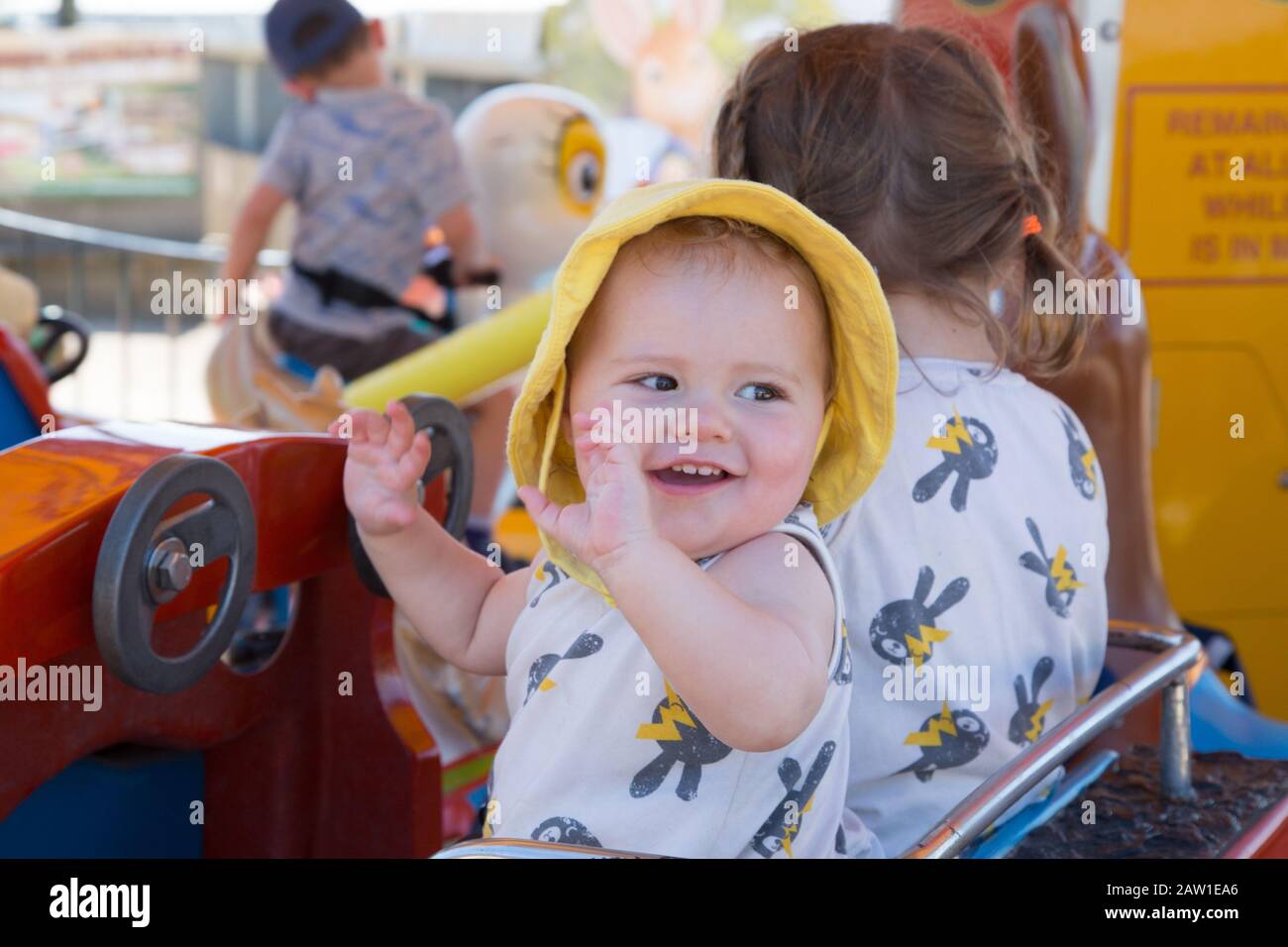 Children on a Merry go Round ride at a funfair, UK Stock Photo - Alamy