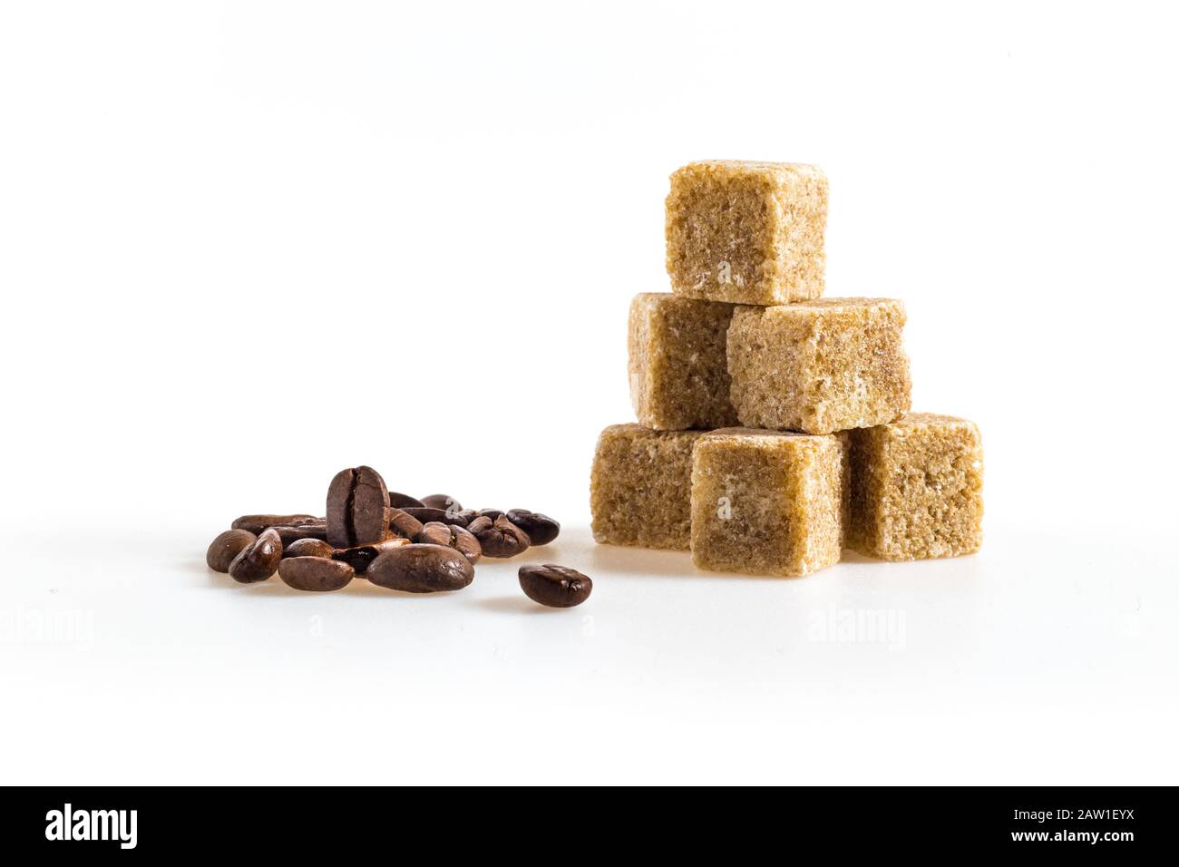 cane sugar cubes and coffee beans on a white background Stock Photo - Alamy