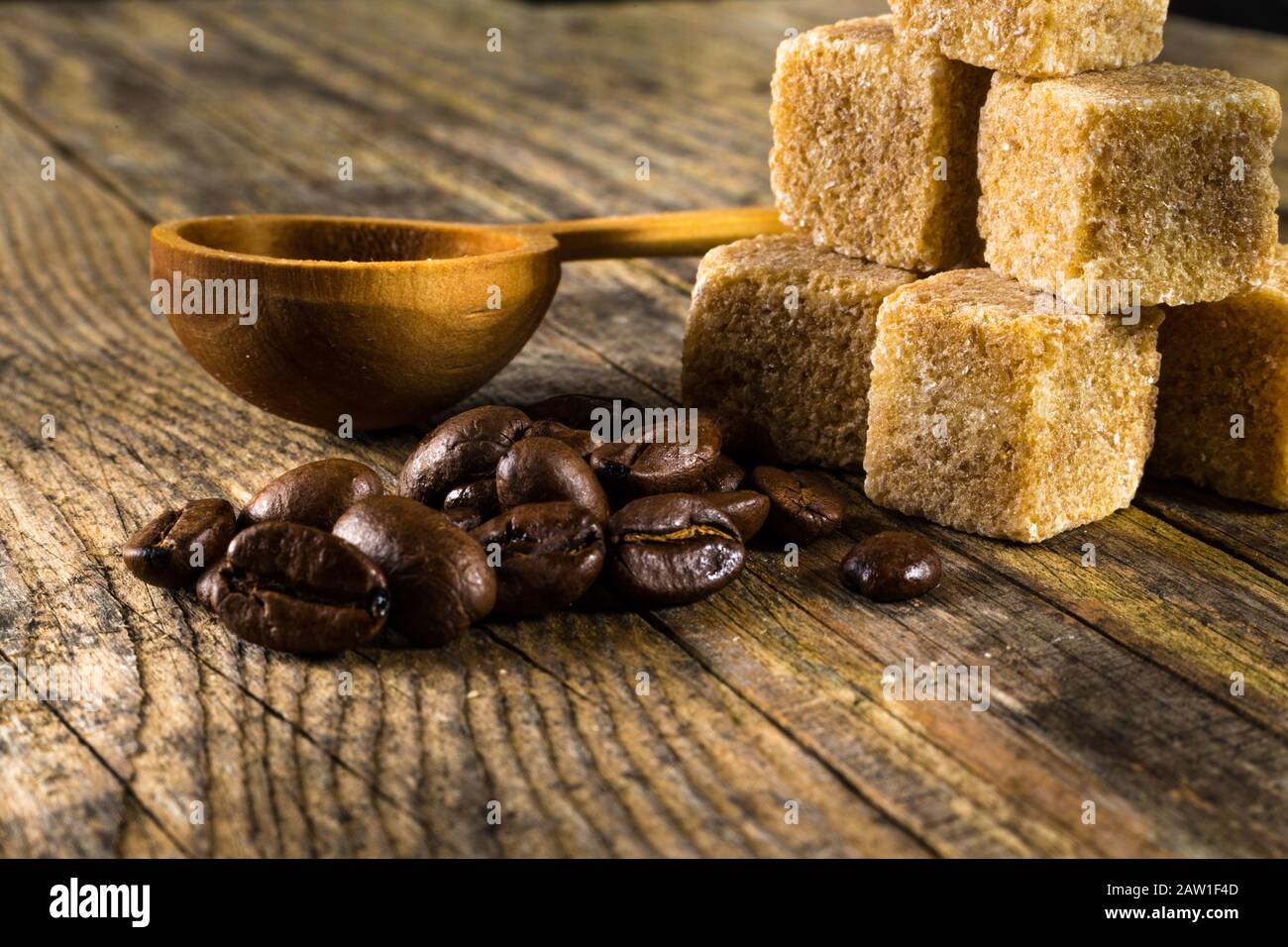 Closeup photo of coffee beans with cane sugar Stock Photo - Alamy