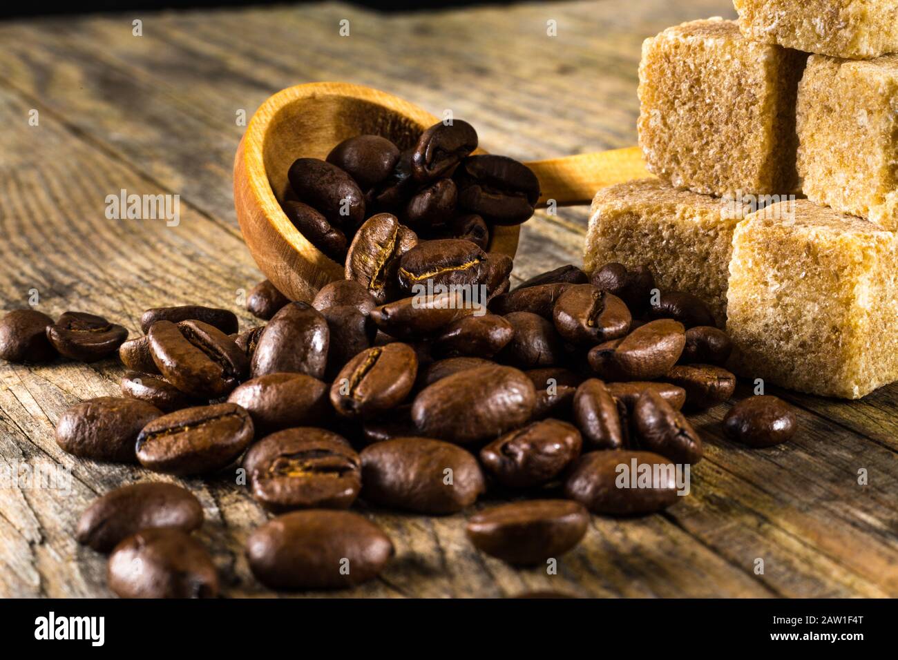 Closeup photo of coffee beans with cane sugar Stock Photo - Alamy